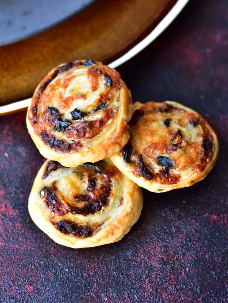Cheese sun-dried tomato and olive puff pastry pinwheels